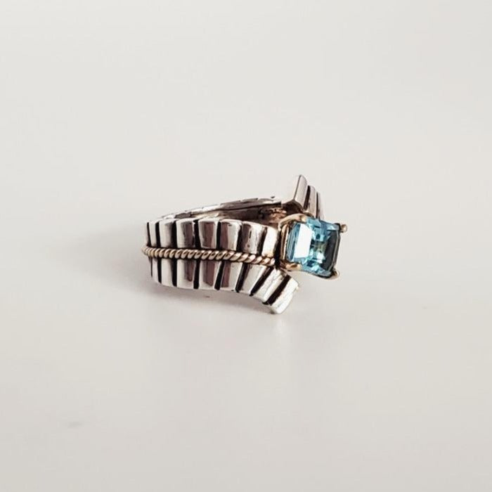 MODERN WITH A CLASSIC TWIST OF STERLING SILVER, BLUE TOPAZ WITH 14KT ...
