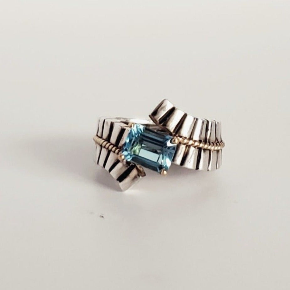 MODERN WITH A CLASSIC TWIST OF STERLING SILVER, BLUE TOPAZ WITH 14KT ...